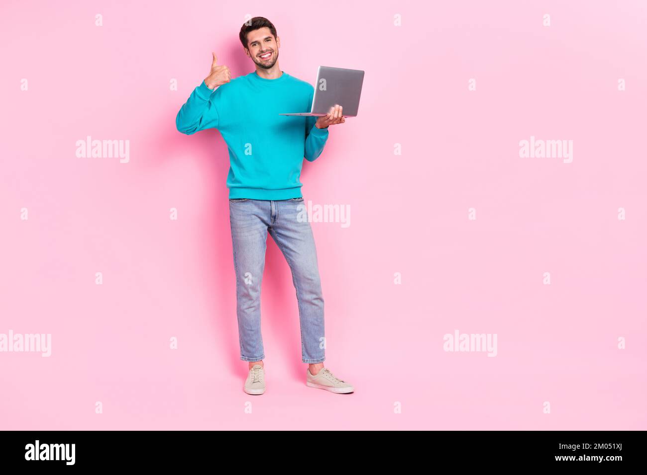 Full length photo of nice young guy hold laptop thumb up professional ...