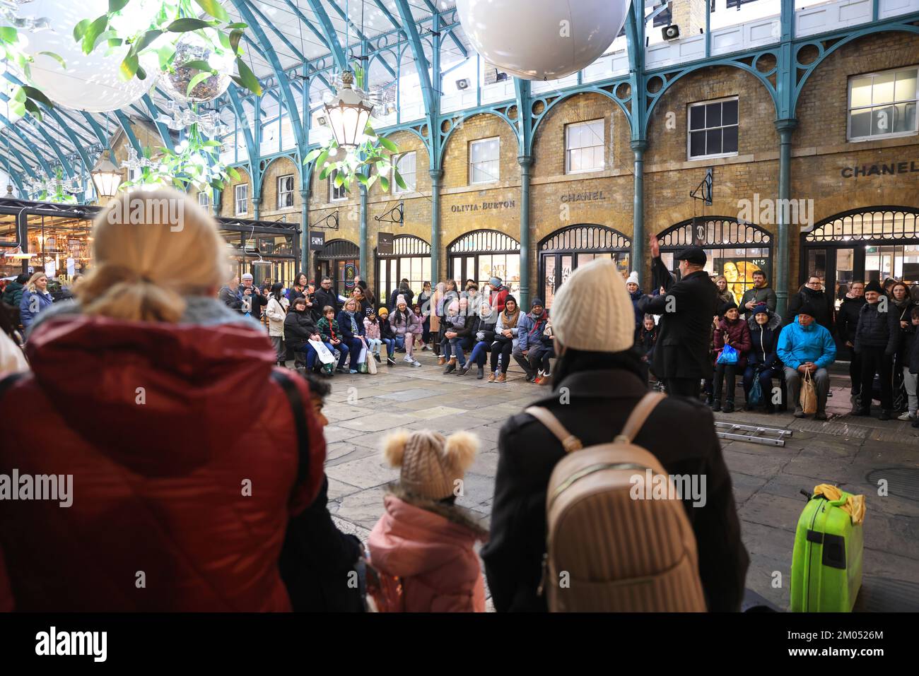 Busker in Covent Garden very busy in the Christmas season, 2022 ...