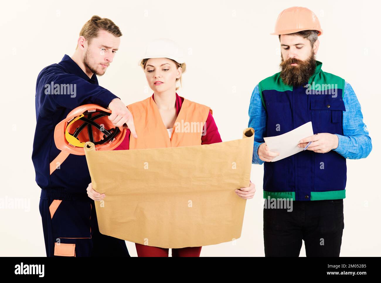 Team work concept. Men and woman in hard hats, helmets Stock Photo - Alamy
