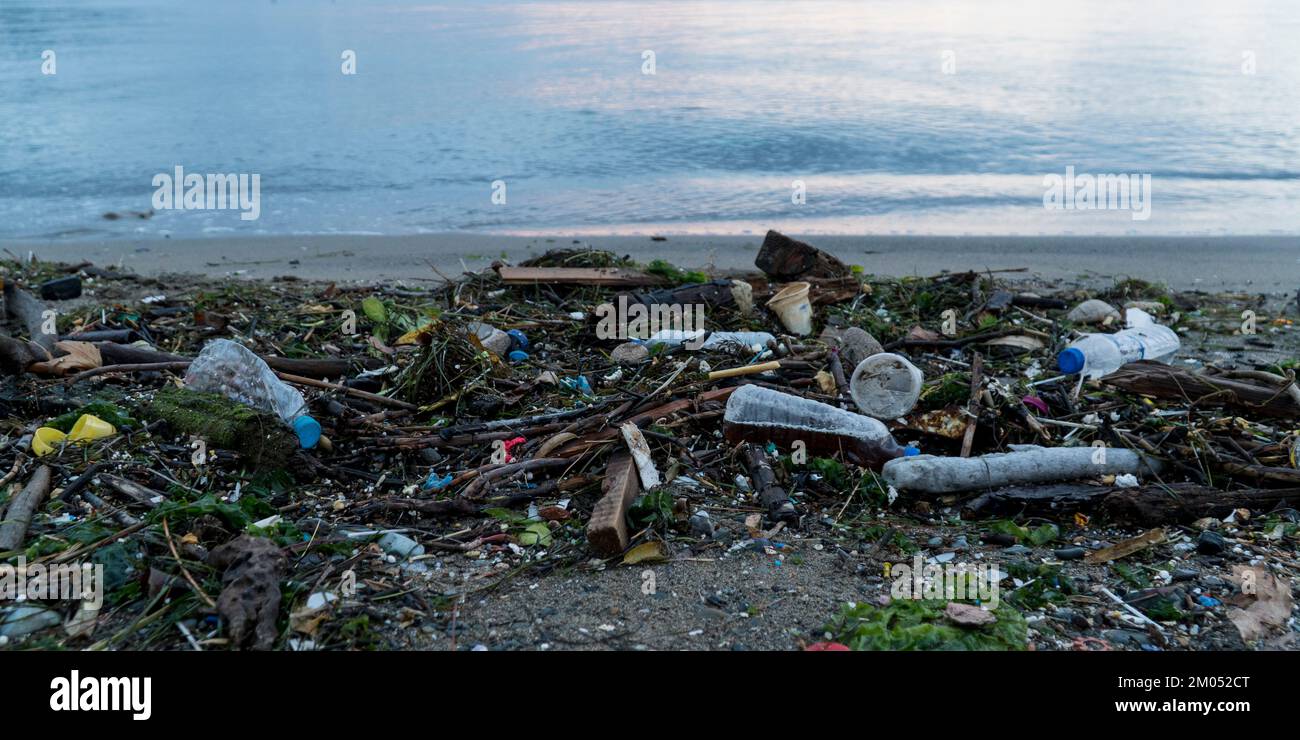 Plastic waste on beach. non-biodegradable waste on beach. Spilled ...