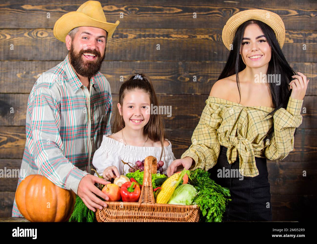 Family farmers with harvest wooden background. Family rustic style ...