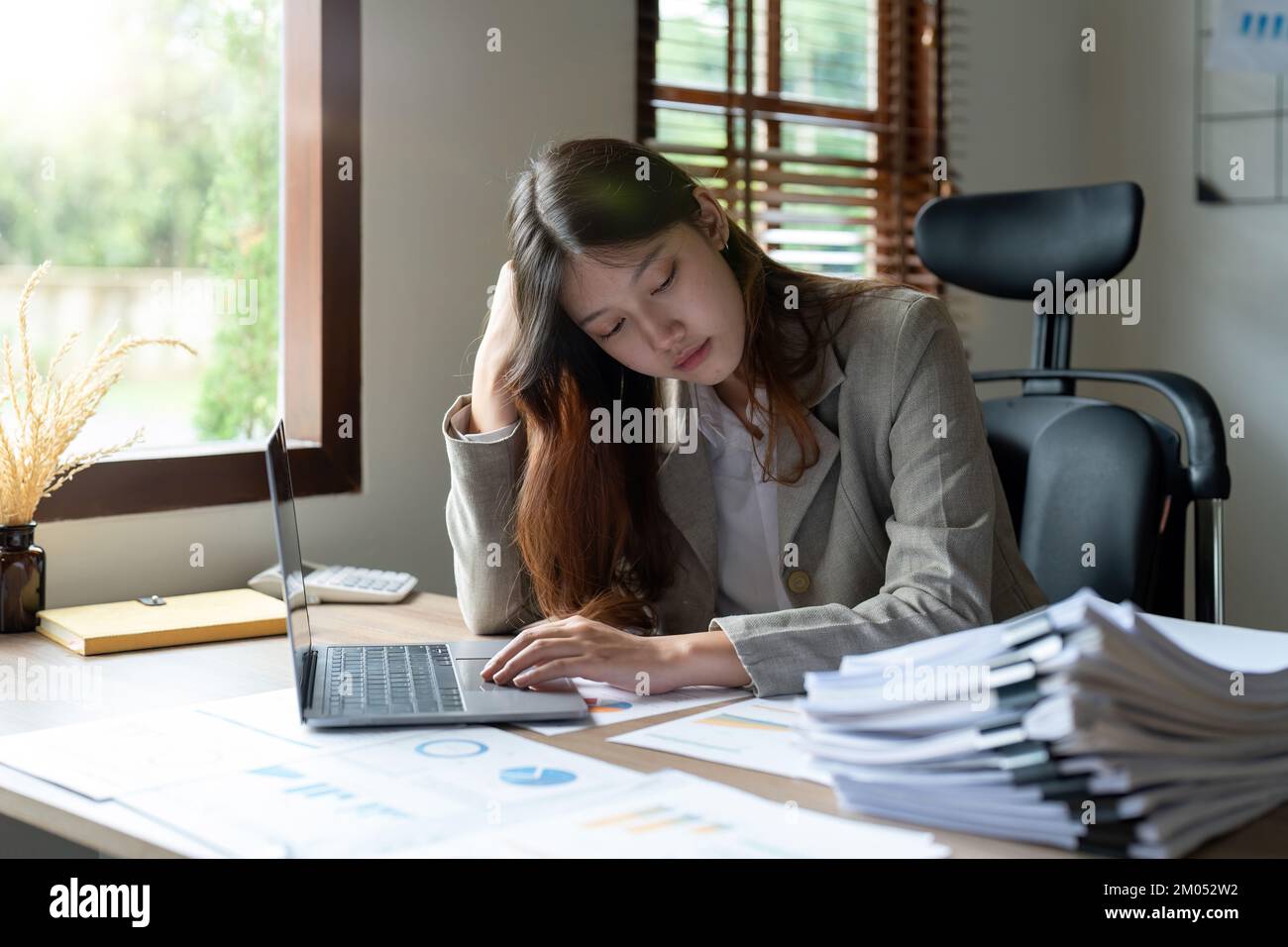 Asian business woman stressed office worker overloaded with paperwork ...