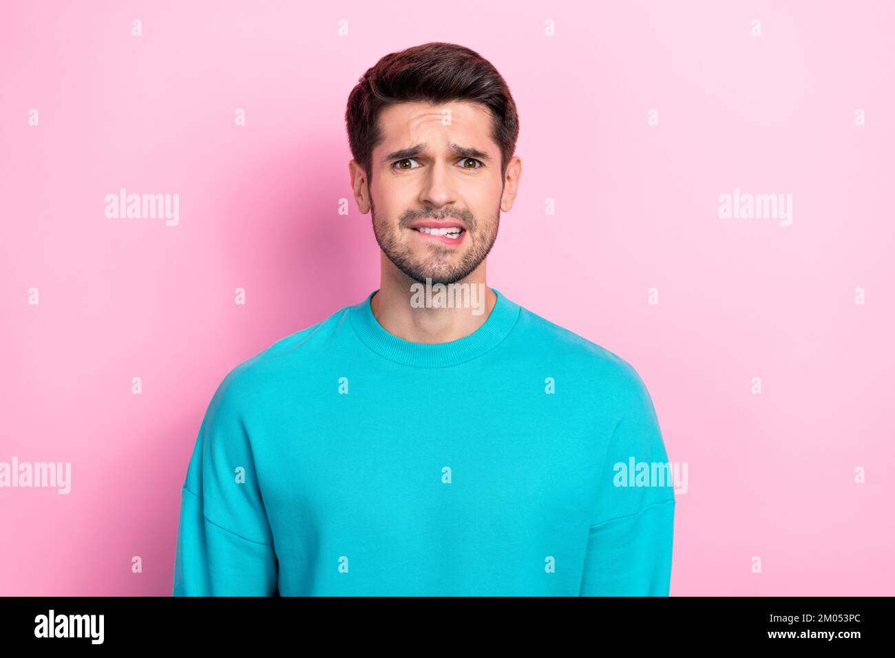 Photo portrait of handsome young man bite lips confused worried ...