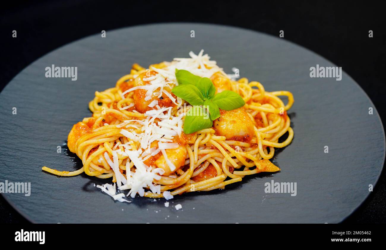 Spaghetti Rigate - italian pasta with scallops and shrimps Stock Photo ...