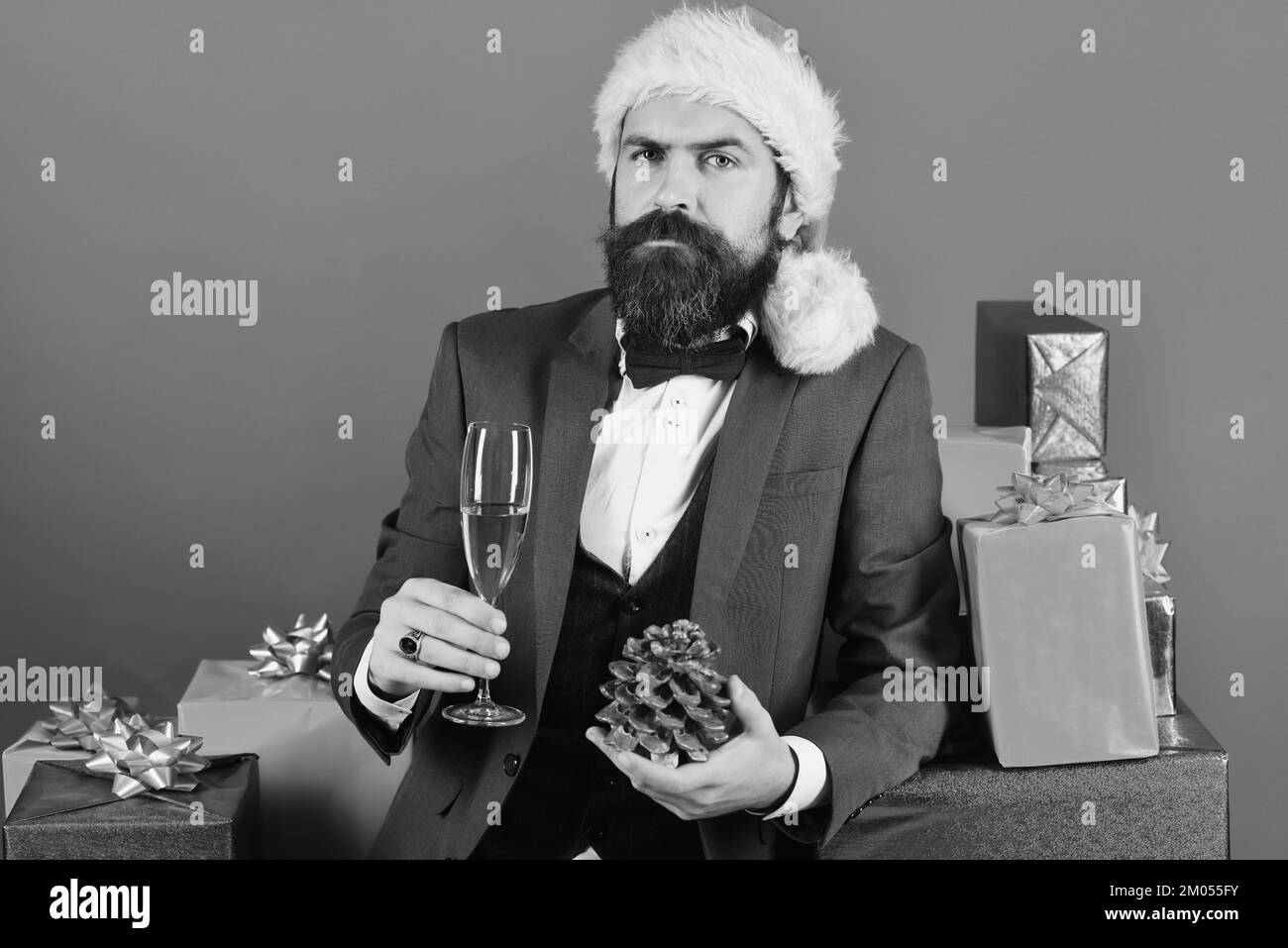 Man holds glass red Black and White Stock Photos & Images - Alamy