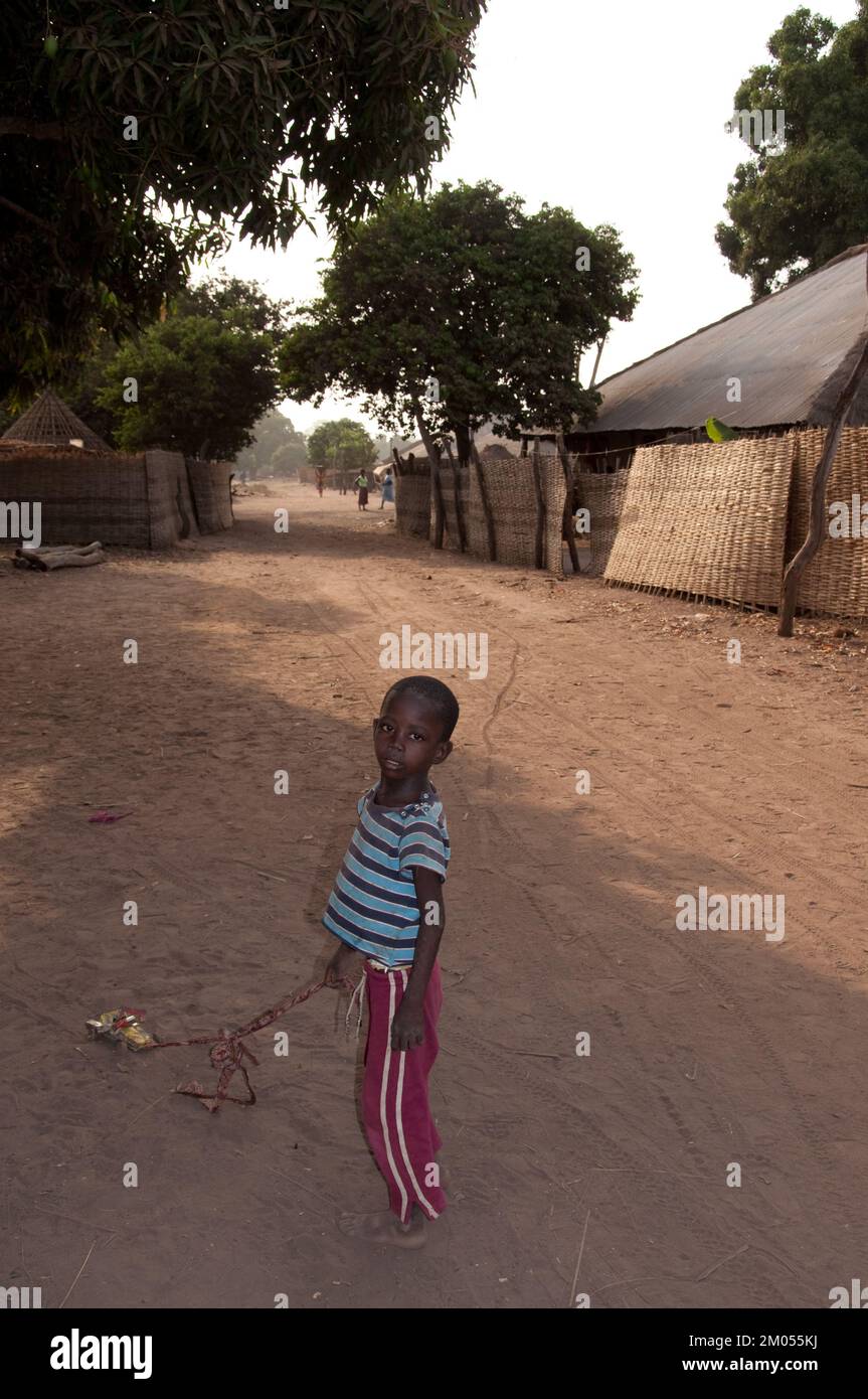 Child playing in the road, Bafata, Guinea Bissau Stock Photo - Alamy