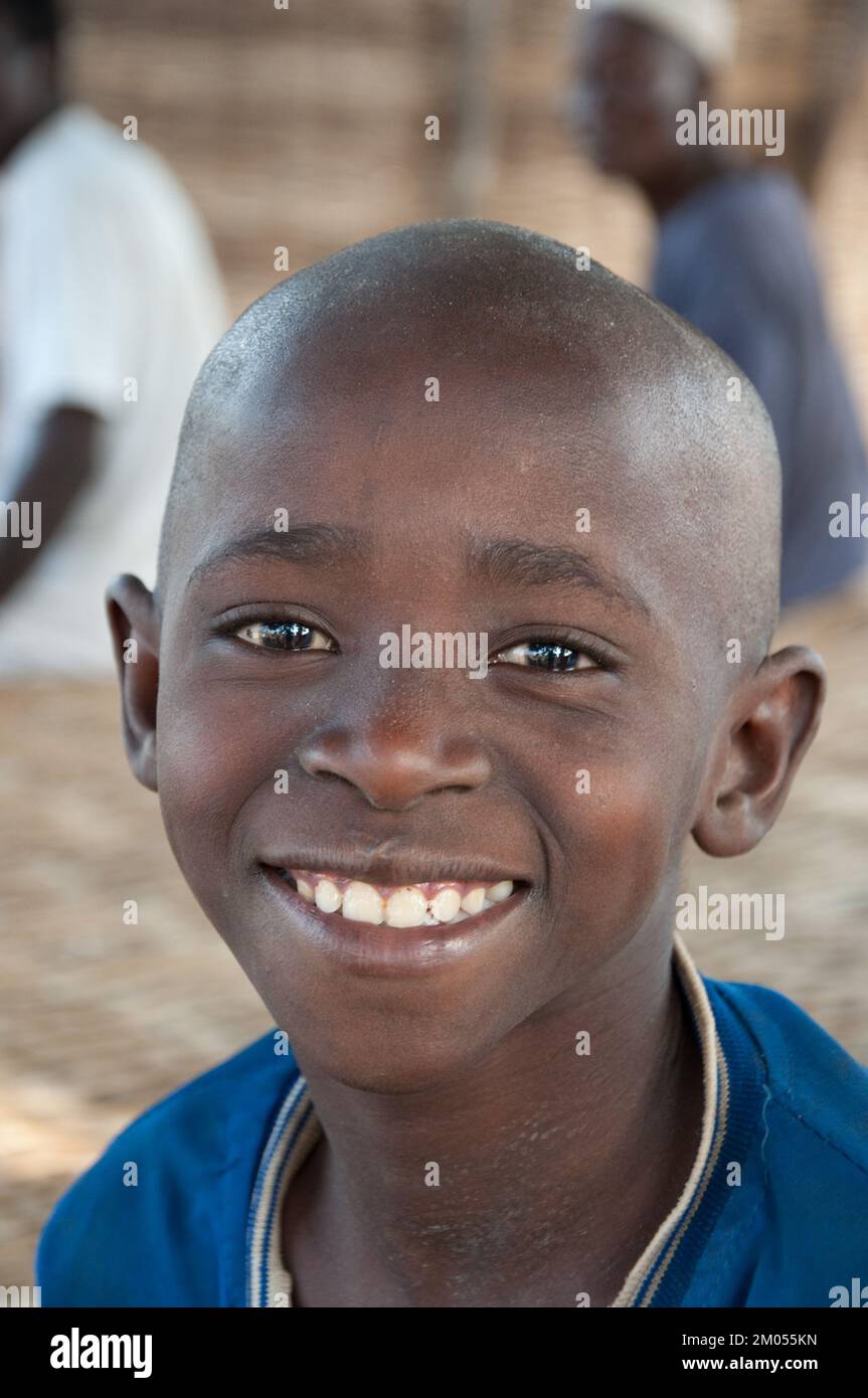 Faces of Africa, young boy, Bafata, Guinea Bissau; Young boy with ...