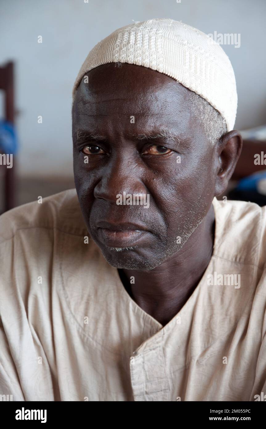 Faces of Africa, African man, Bafata, Guinea Bissau; Man with stern ...
