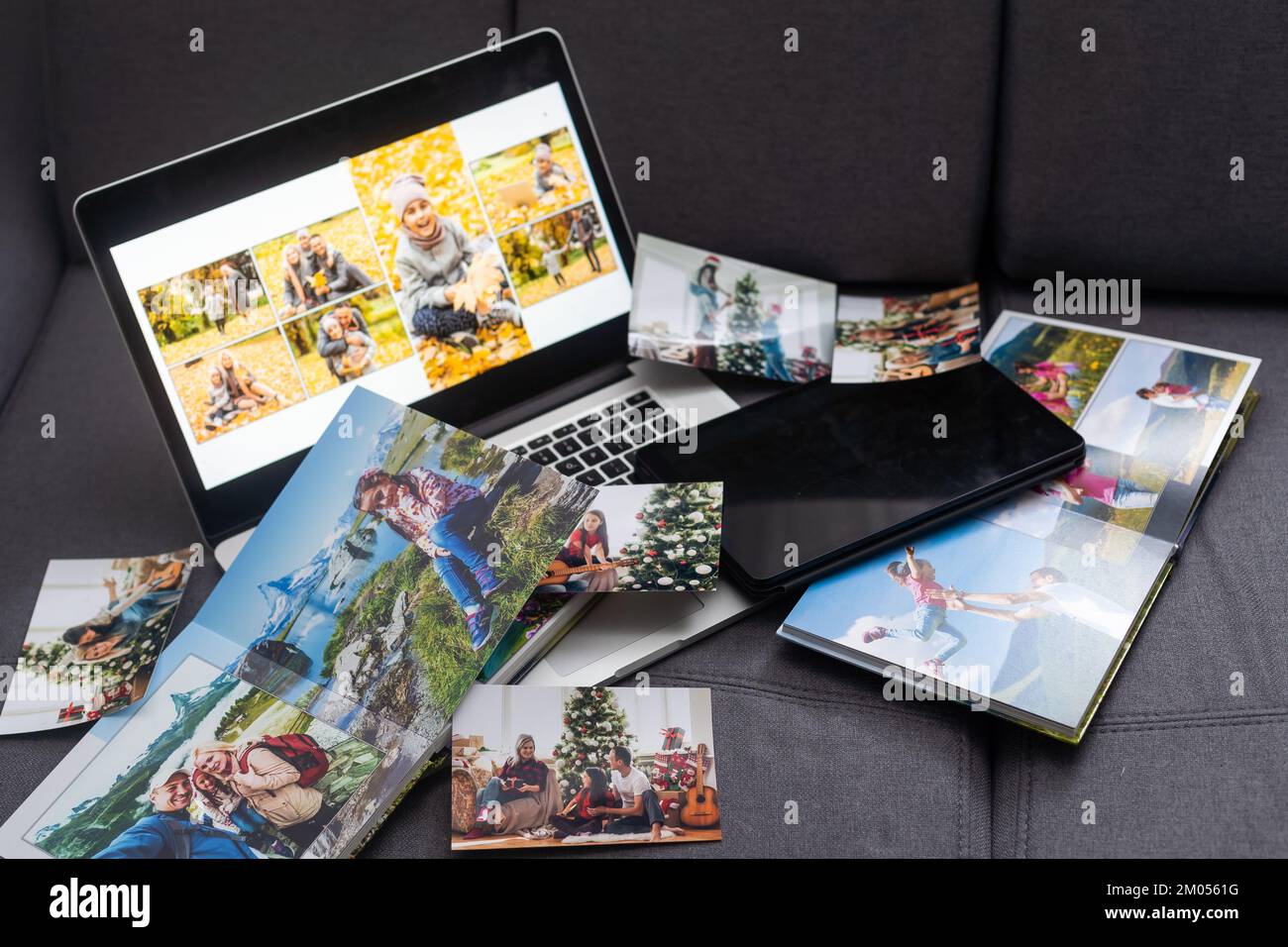 Laptop with photo, photoalbum, album Stock Photo - Alamy
