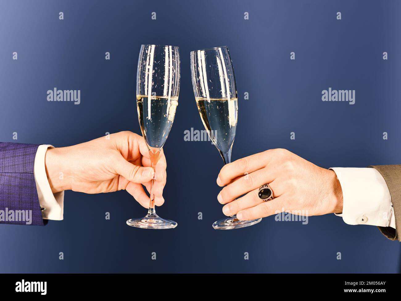 Corporate Christmas party concept. Businessmen raising toast with ...