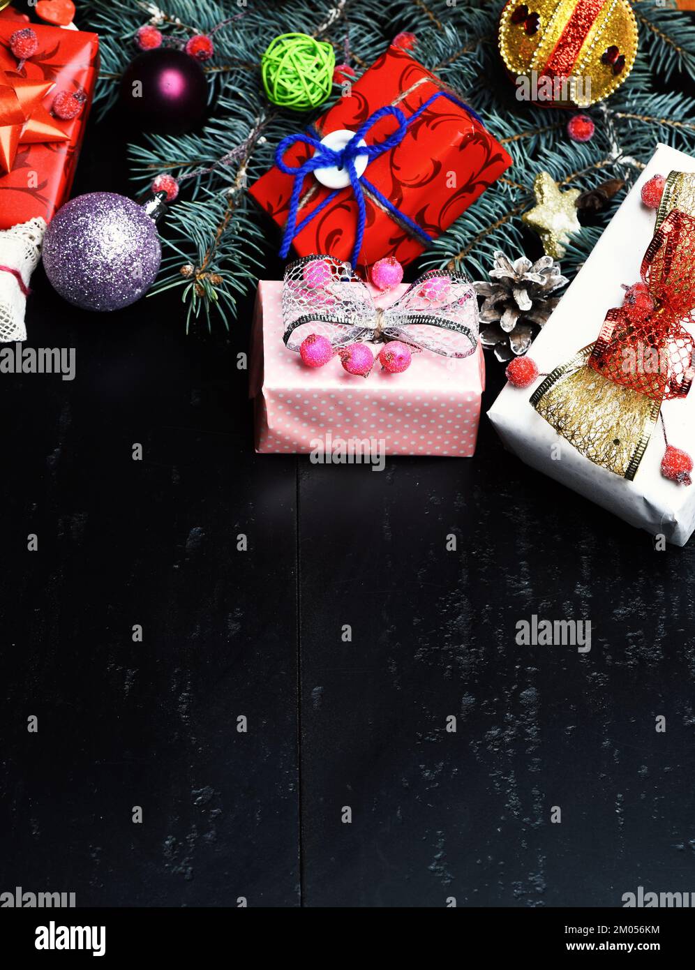 Fir tree branches and colorful balls. Decor made of gifts Stock Photo ...