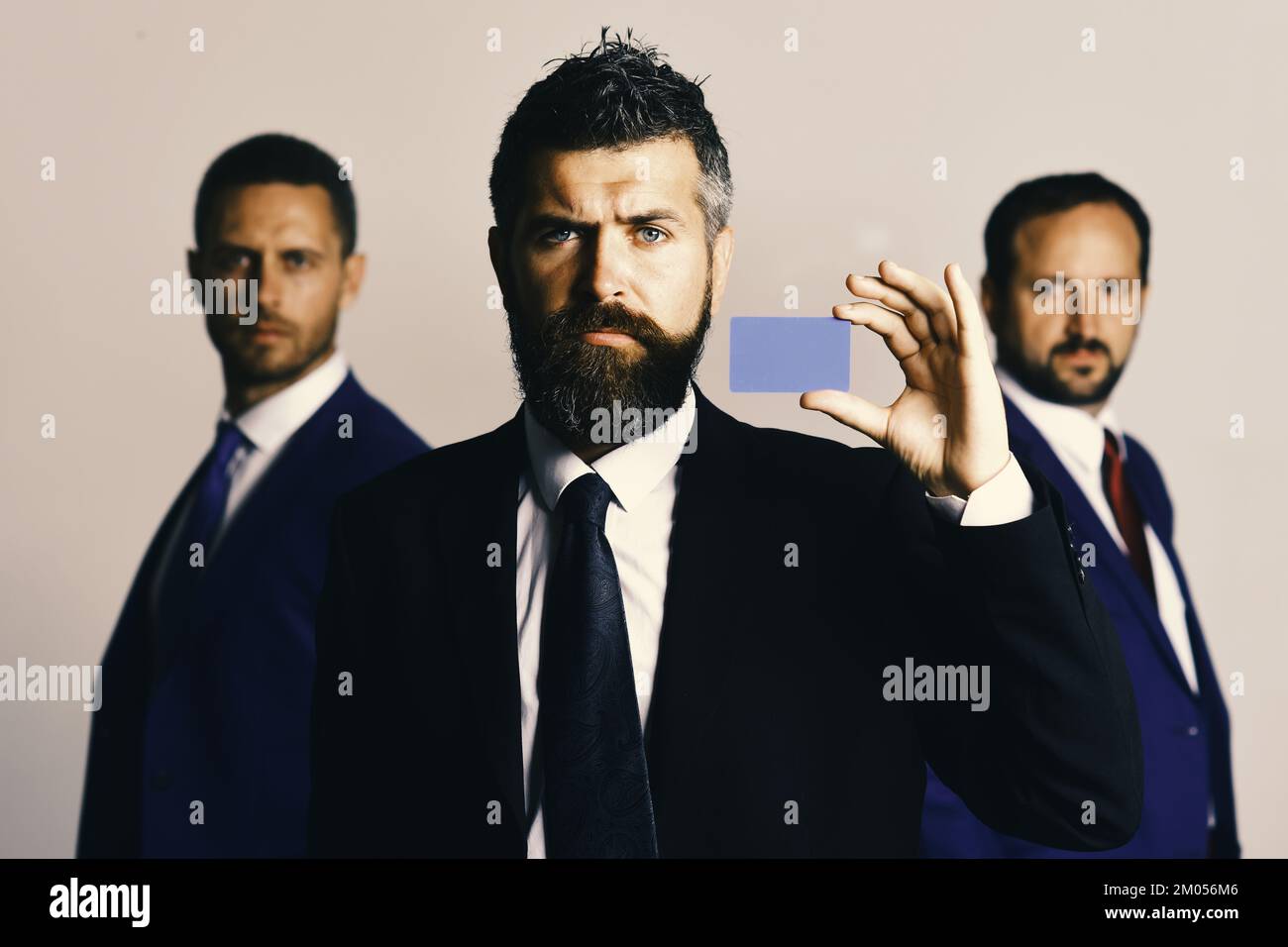 Men with beard and serious faces advertise company and partnership ...