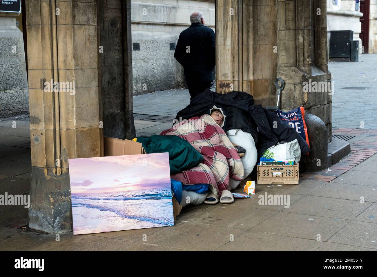 Person sleeping rough under the Stonebow, High street Lincoln 2022 ...