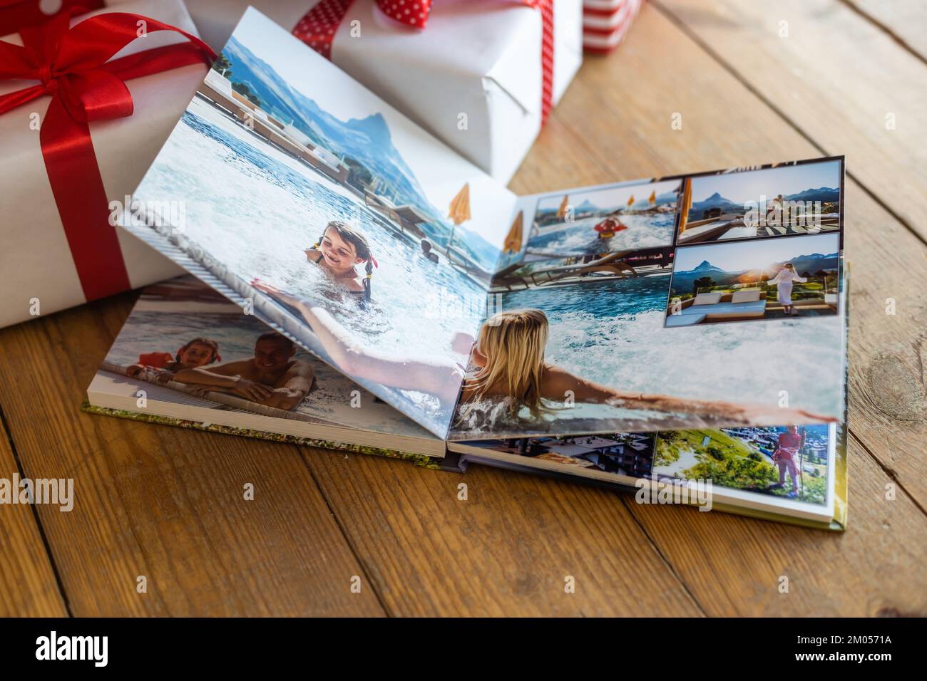 a Photobook of family.Photobook is gift. photo album next to gifts ...
