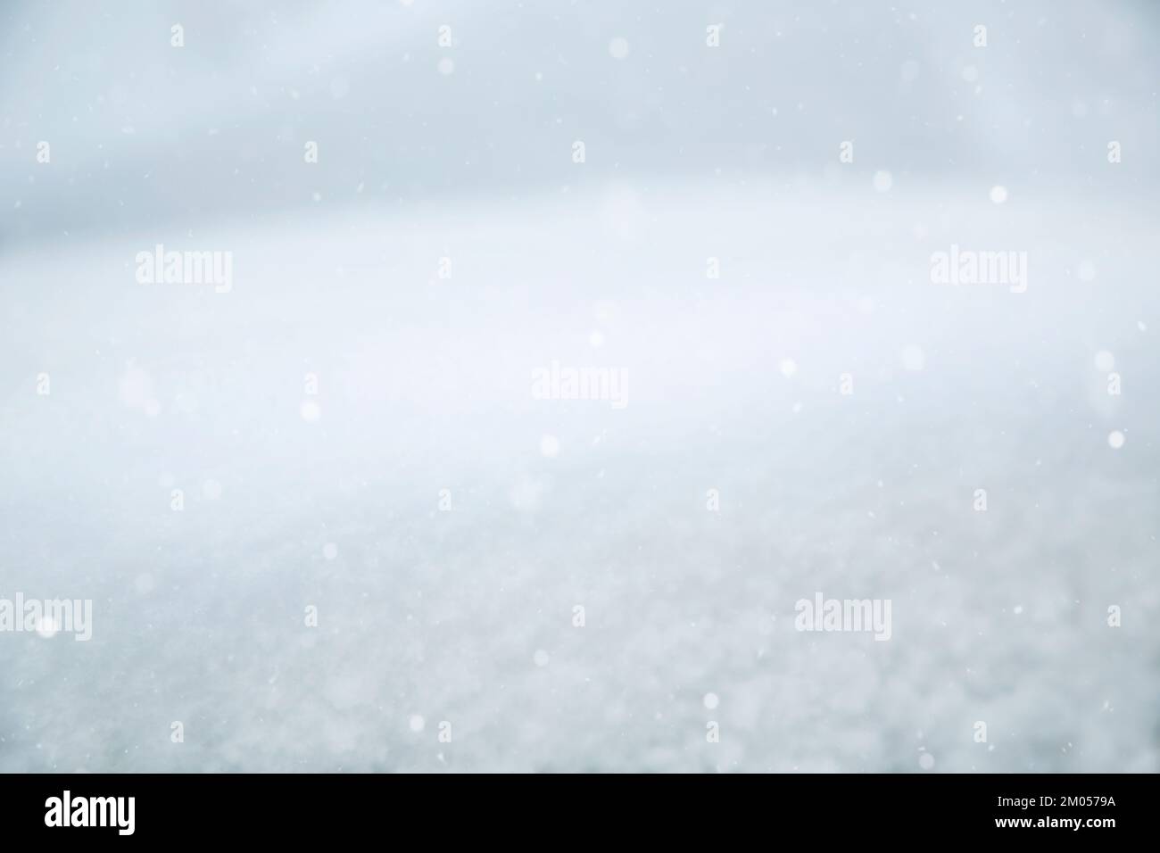 Winter landscape. It's snowing outside. Snowflakes are falling and ...