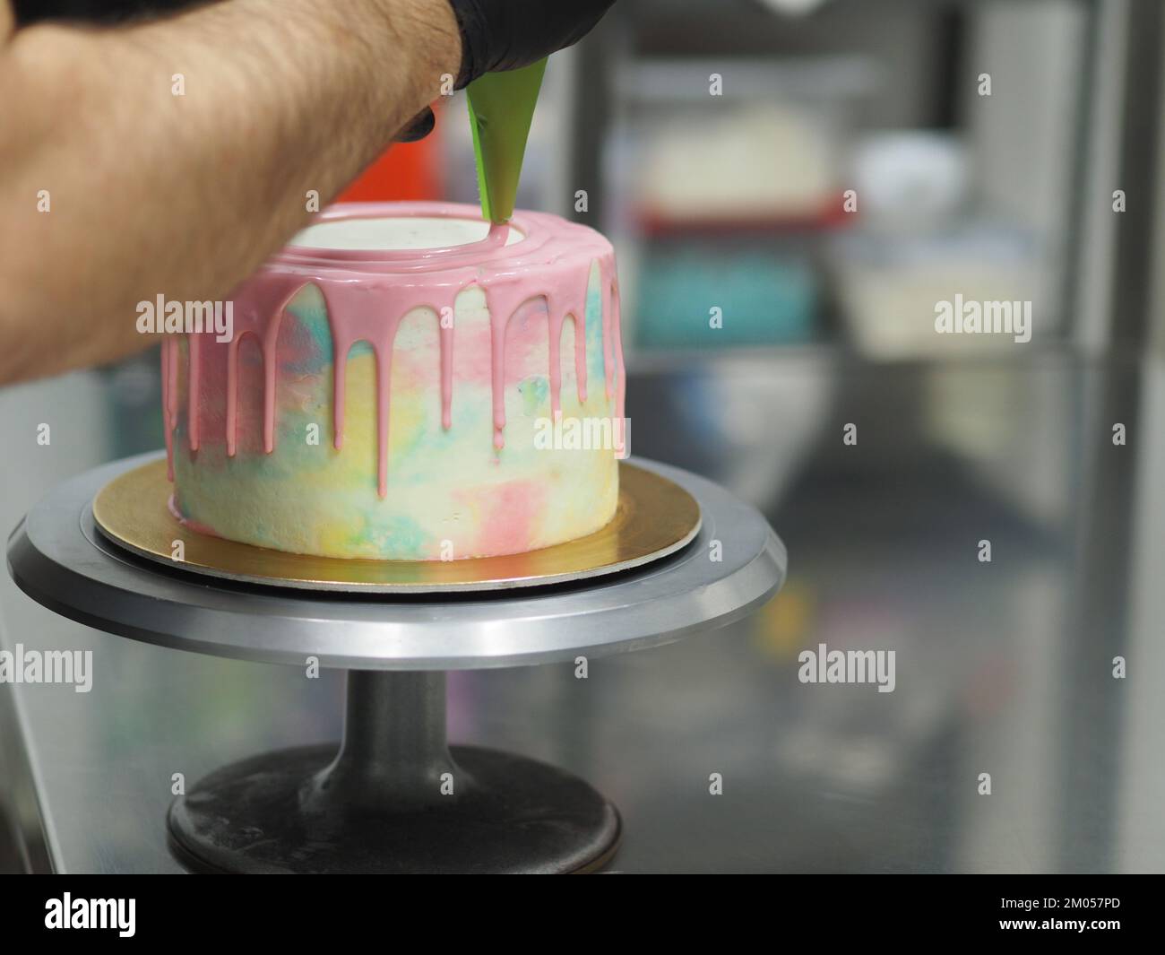 pasty chef artisan squeeze piping bag filling mixed with edible pink ...