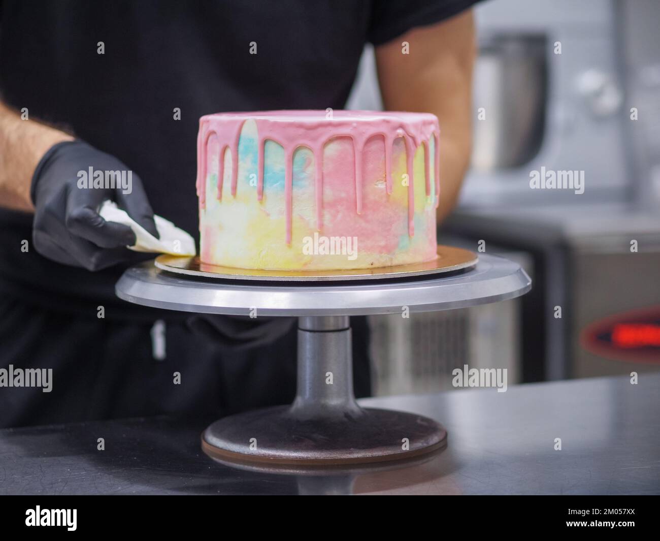 pasty chef artisan squeeze piping bag filling mixed with edible pink ...