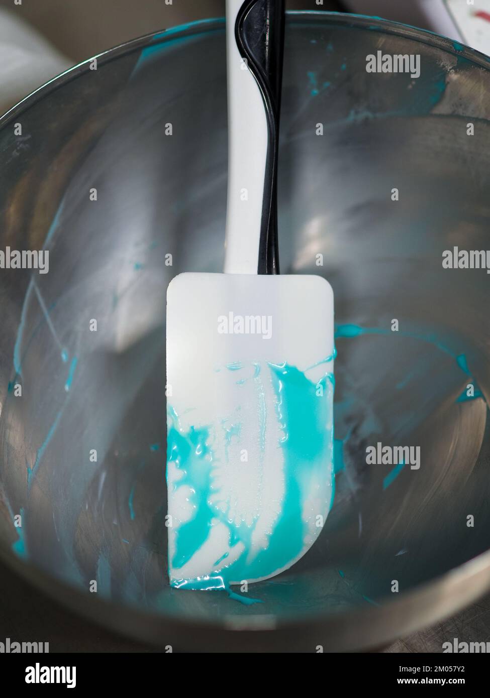 dirty spatula after pastry chef stirring piping bag filling mixed with ...