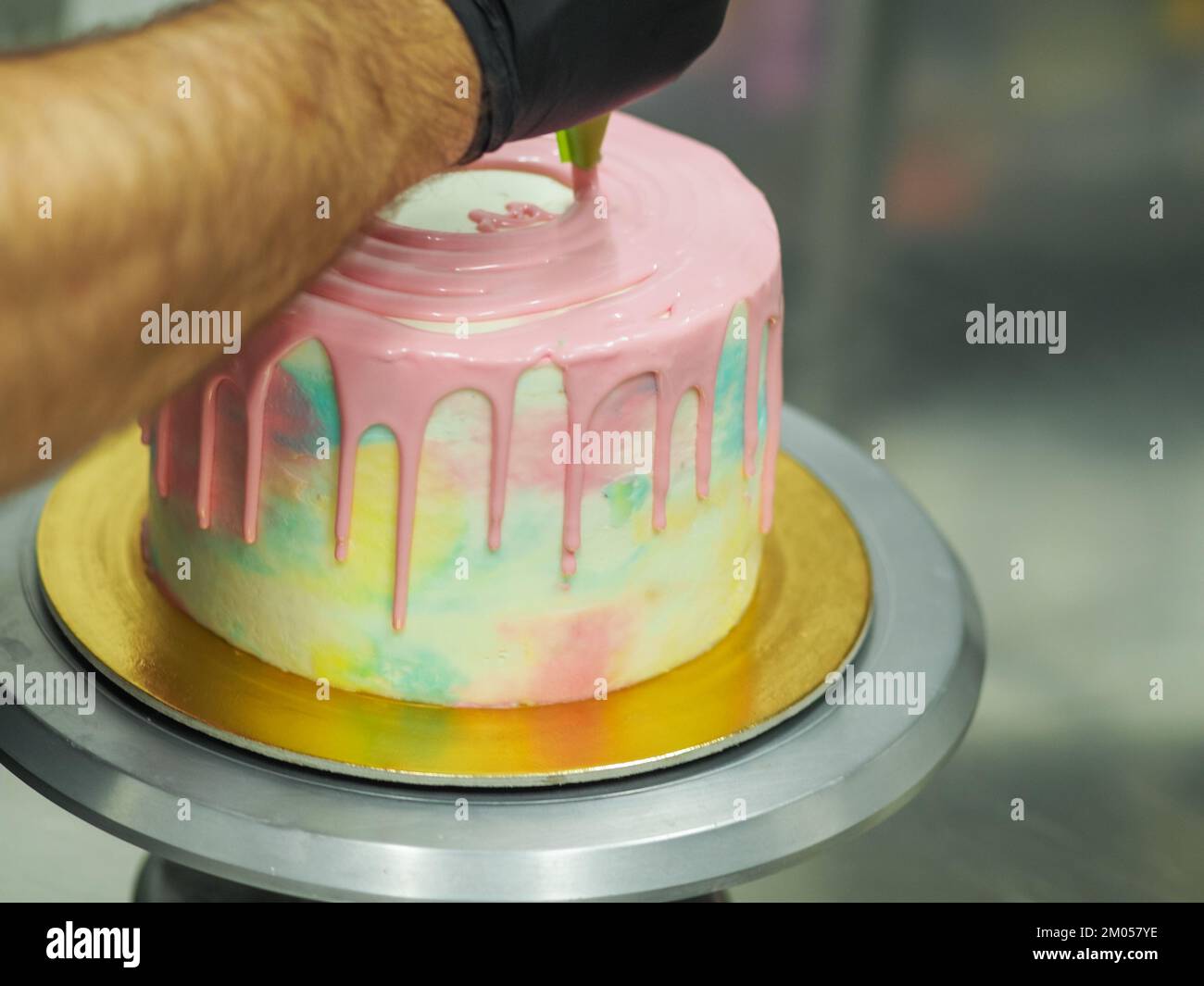 pasty chef artisan squeeze piping bag filling mixed with edible pink ...