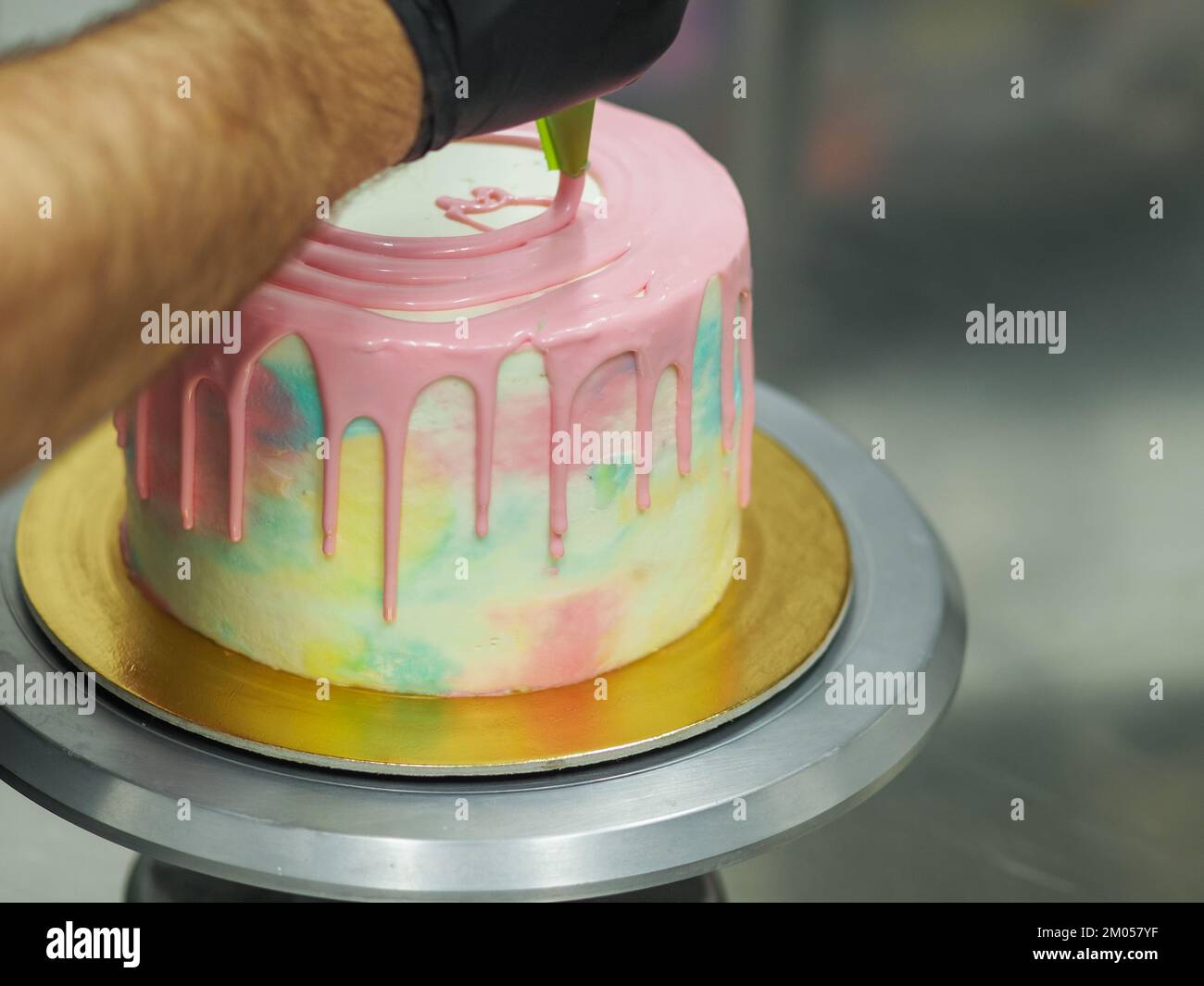 pasty chef artisan squeeze piping bag filling mixed with edible pink ...