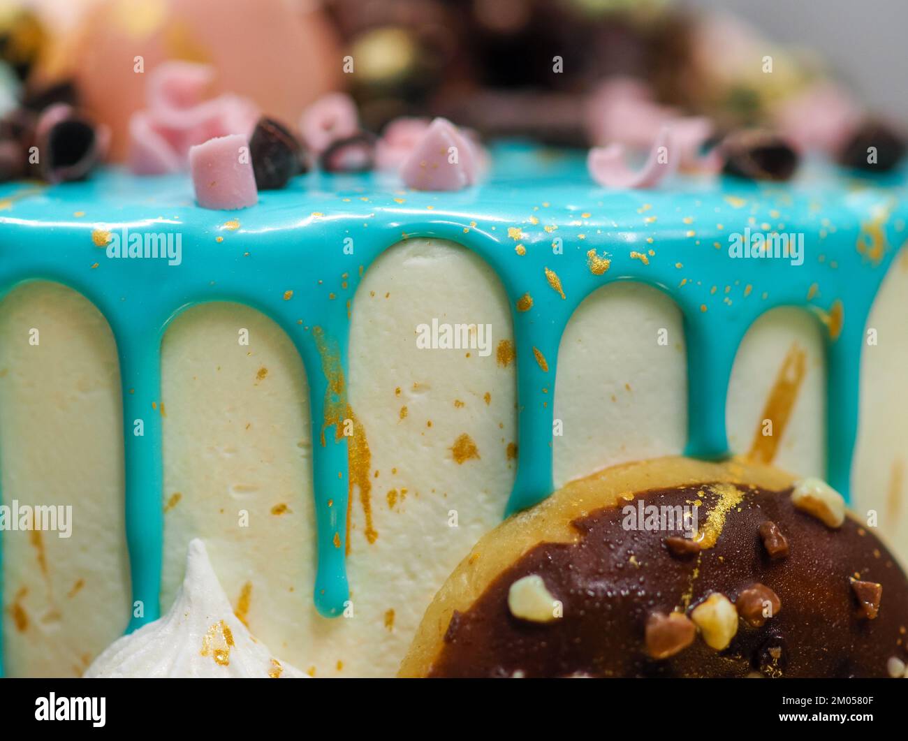 donuts meringue berries and sparkles topping on frosted icing drip ...