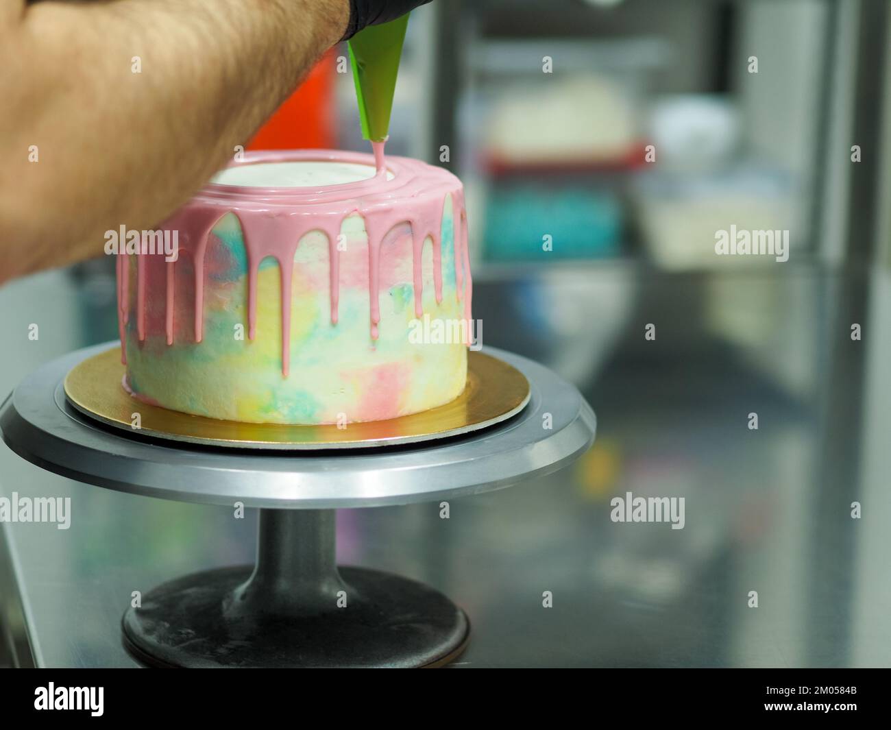 pasty chef artisan squeeze piping bag filling mixed with edible pink ...