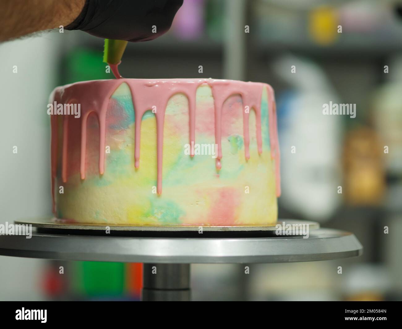 pasty chef artisan squeeze piping bag filling mixed with edible pink ...