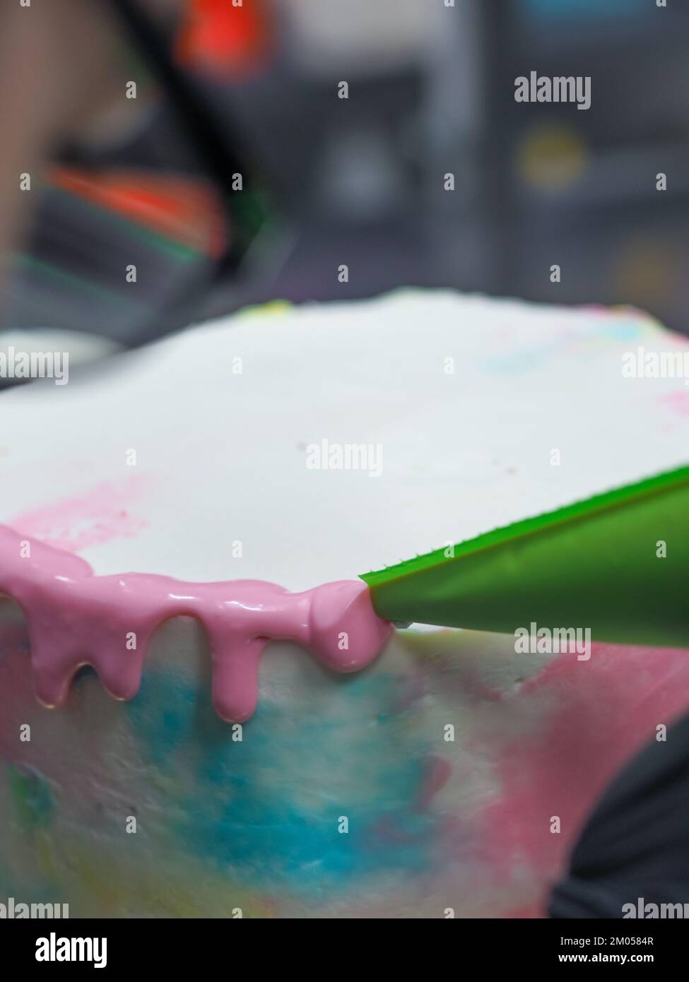 cake designer squeeze piping bag filling mixed with edible pink paint ...