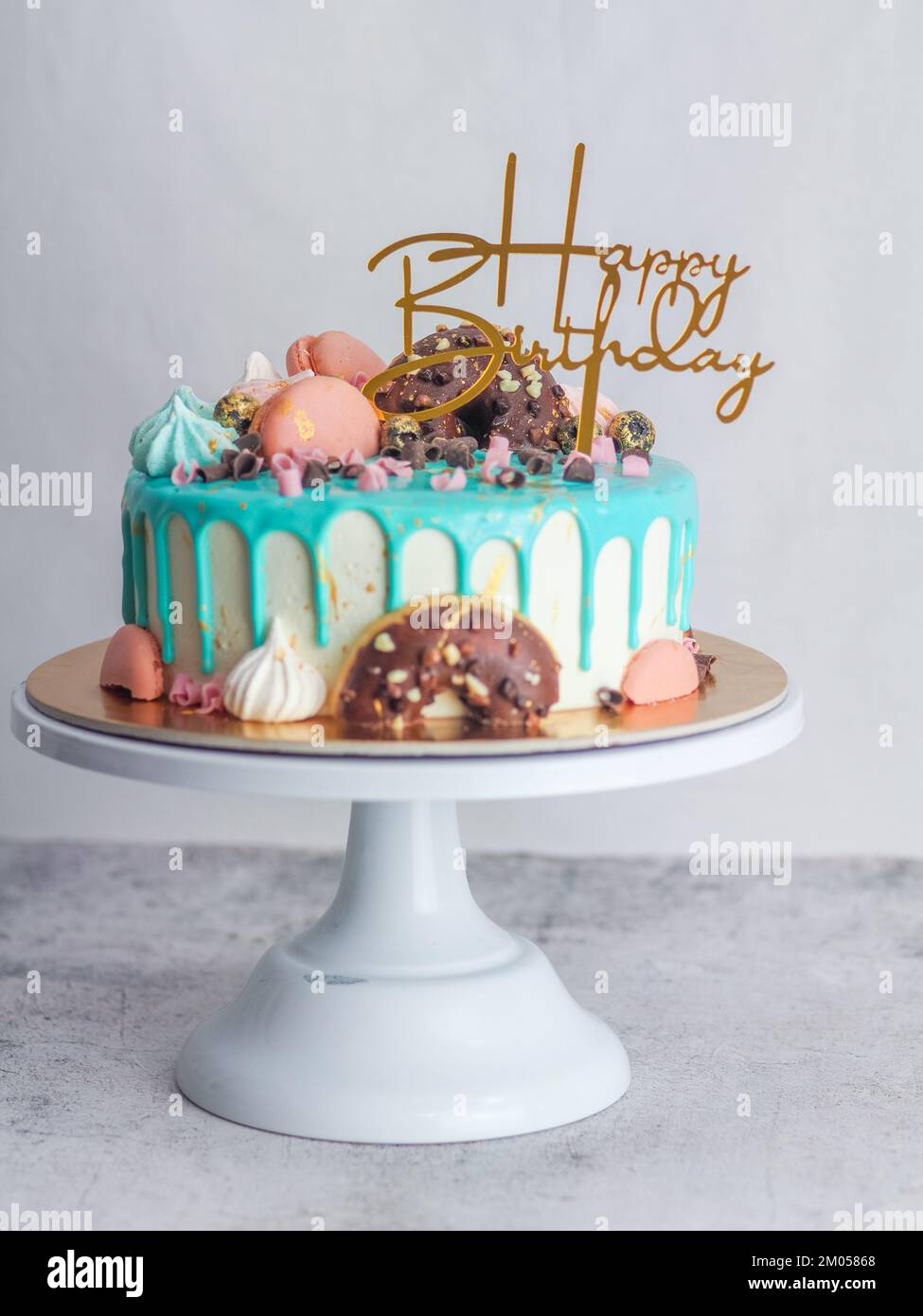 donuts meringue berries and sparkles topping on frosted icing drip ...