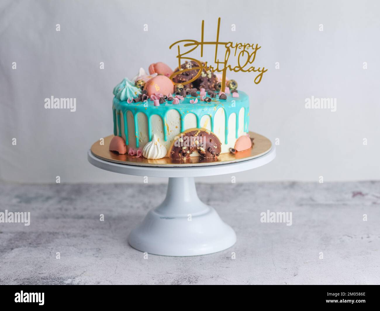 donuts meringue berries and sparkles topping on frosted icing drip ...