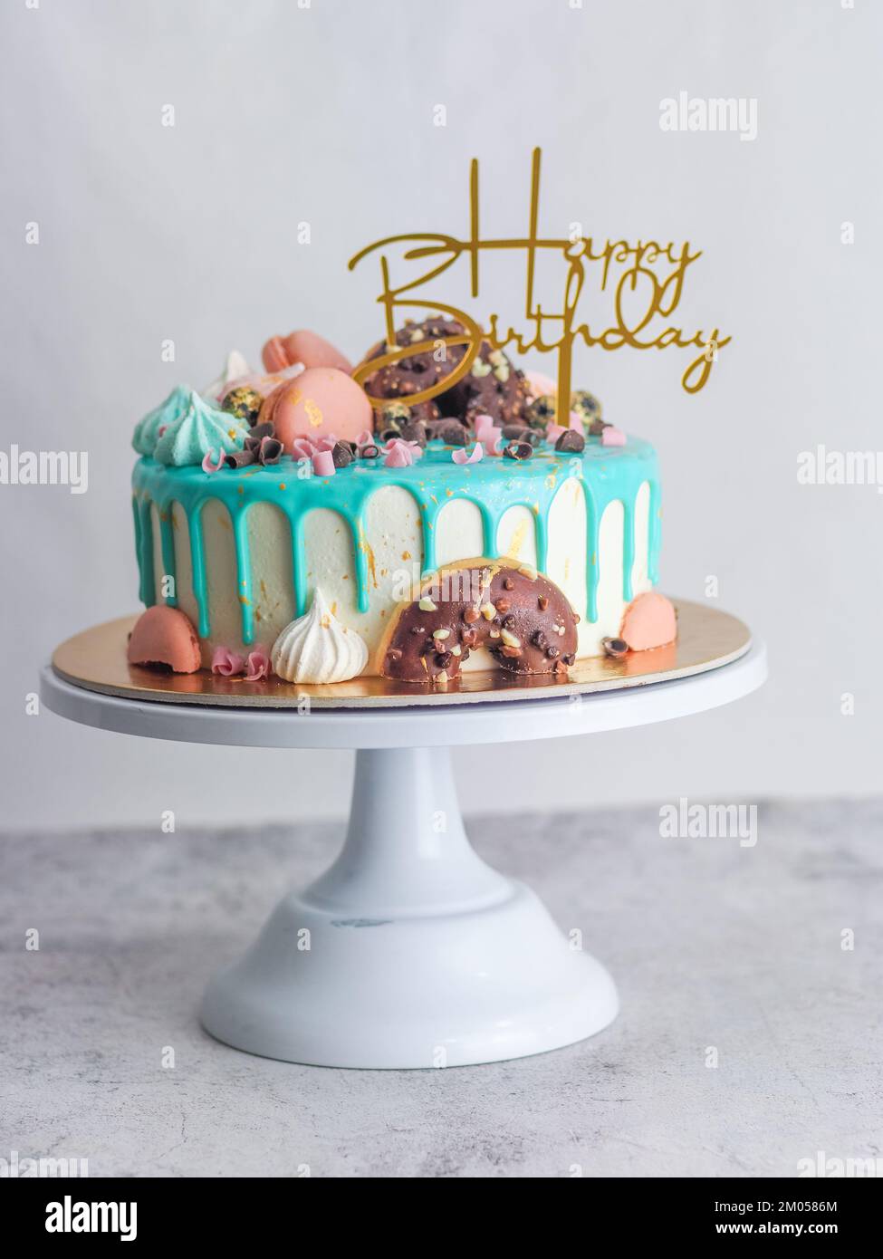 donuts meringue berries and sparkles topping on frosted icing drip ...