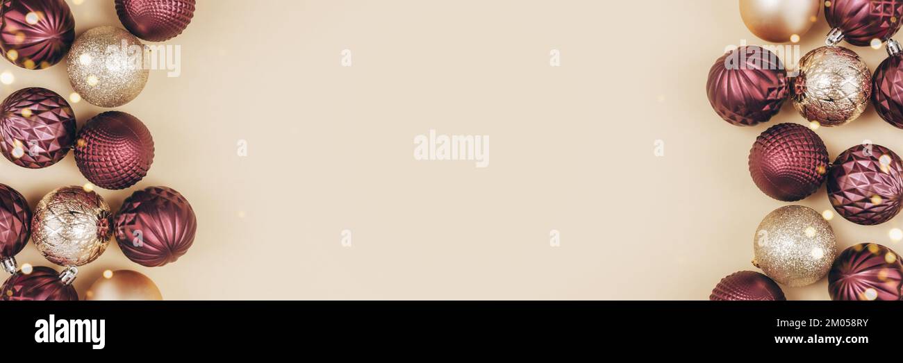 Banner with Christmas golden and purple glitter bauble balls on neutral ...