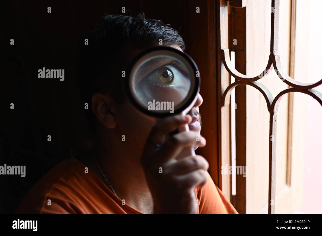 EYE THROUGH A MAGNIFYING GLASS Stock Photo - Alamy
