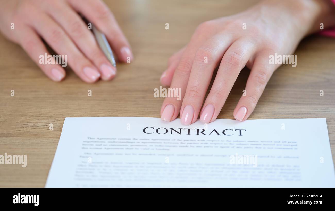 HR manager asks new employee to sign contract Stock Photo - Alamy