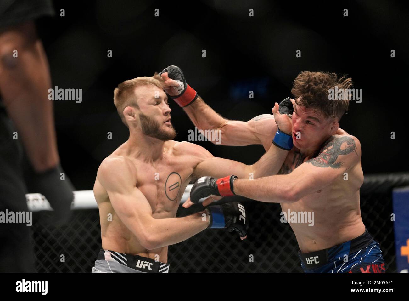 ORLANDO, FL - December 3: Darren Elkins (L) and Jonathan Pearce (R ...