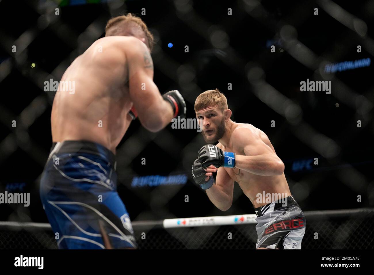 ORLANDO, FL - December 3: Darren Elkins (L) and Jonathan Pearce (R ...