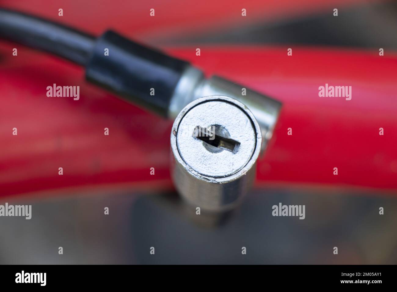bicycle lock mounted on a red bicycle Stock Photo - Alamy