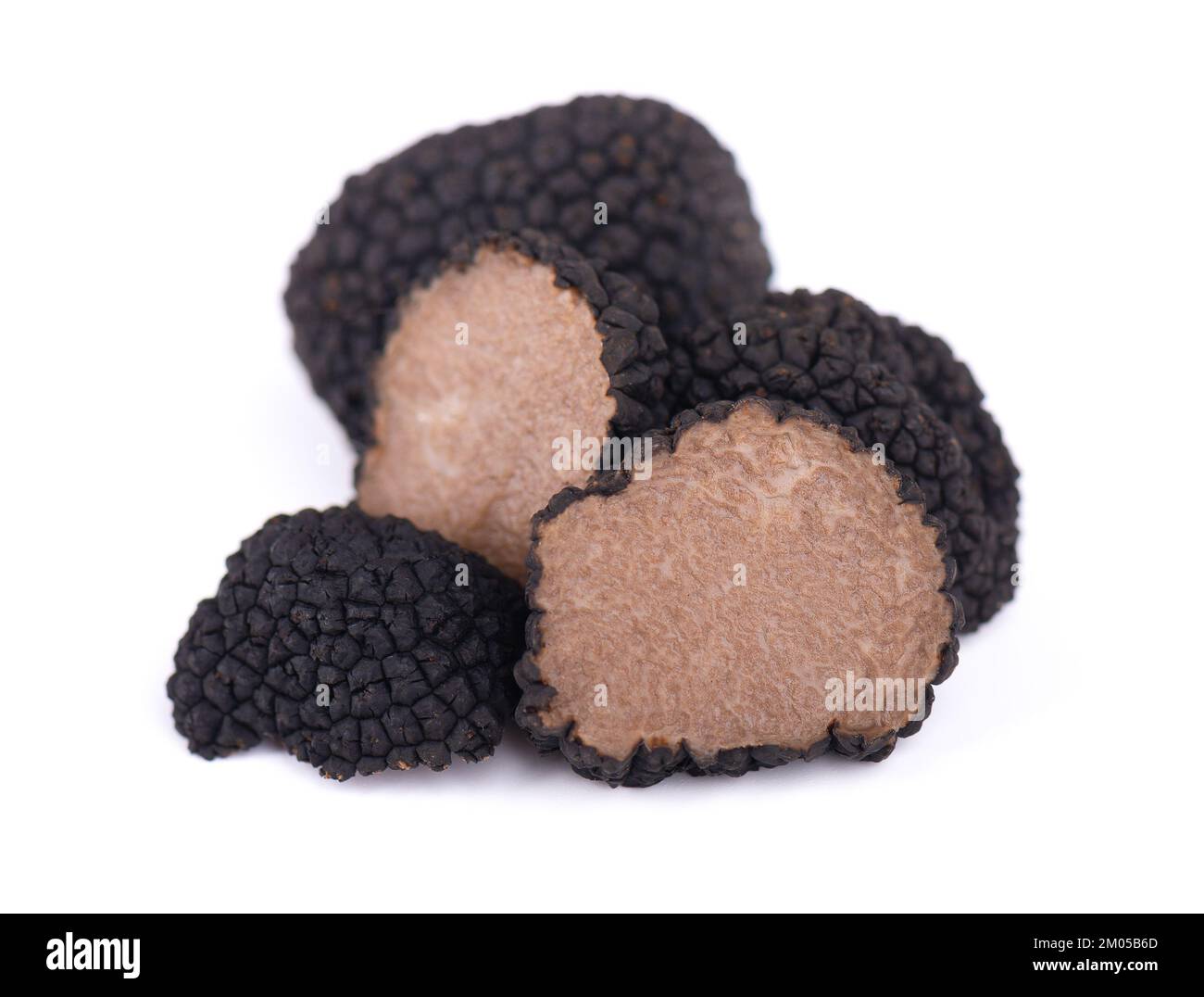 Black truffles isolated on a white background. Fresh sliced truffle ...