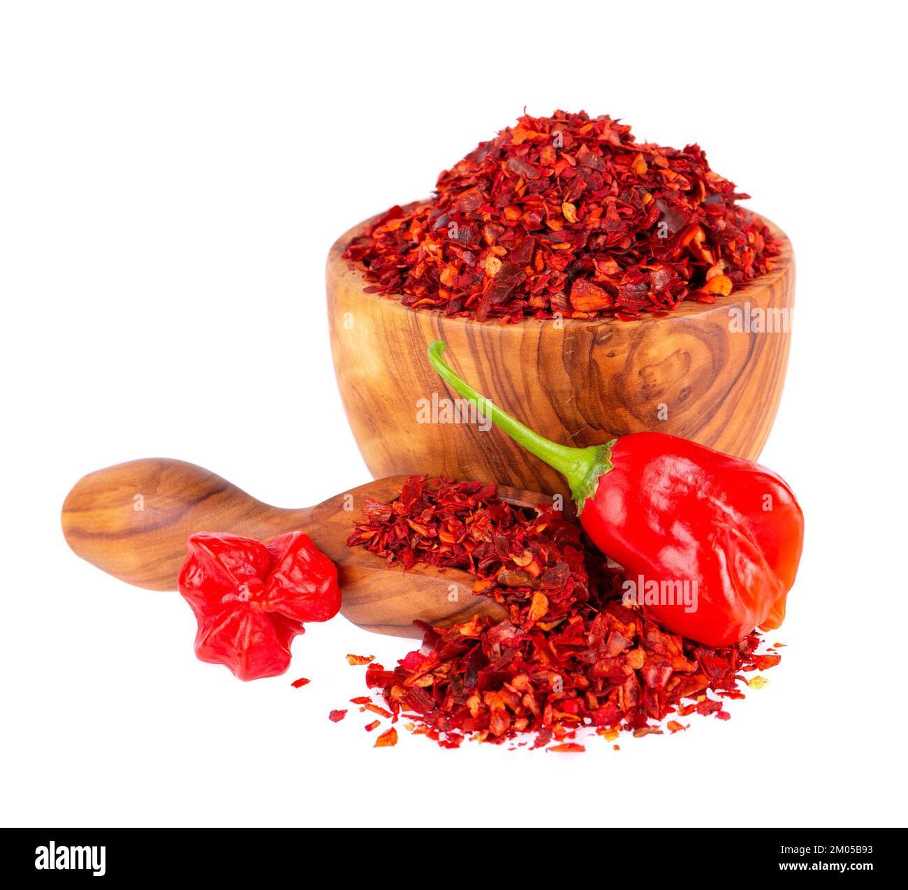 Fresh and dry ground red chili peppers isolated on white background ...