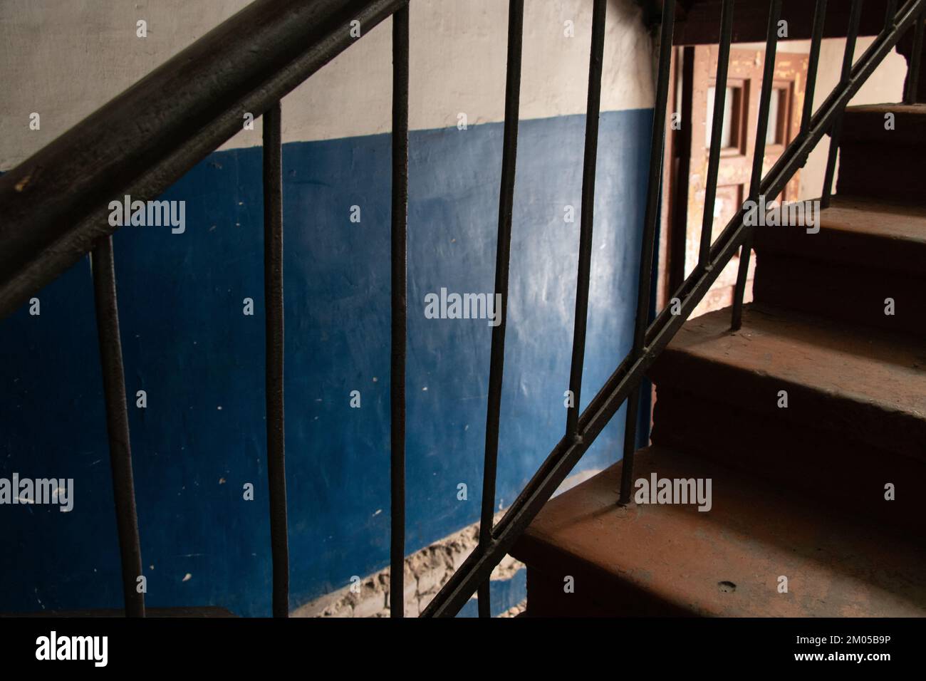 old soviet dirty dark staircase at the entrance of an apartment ...
