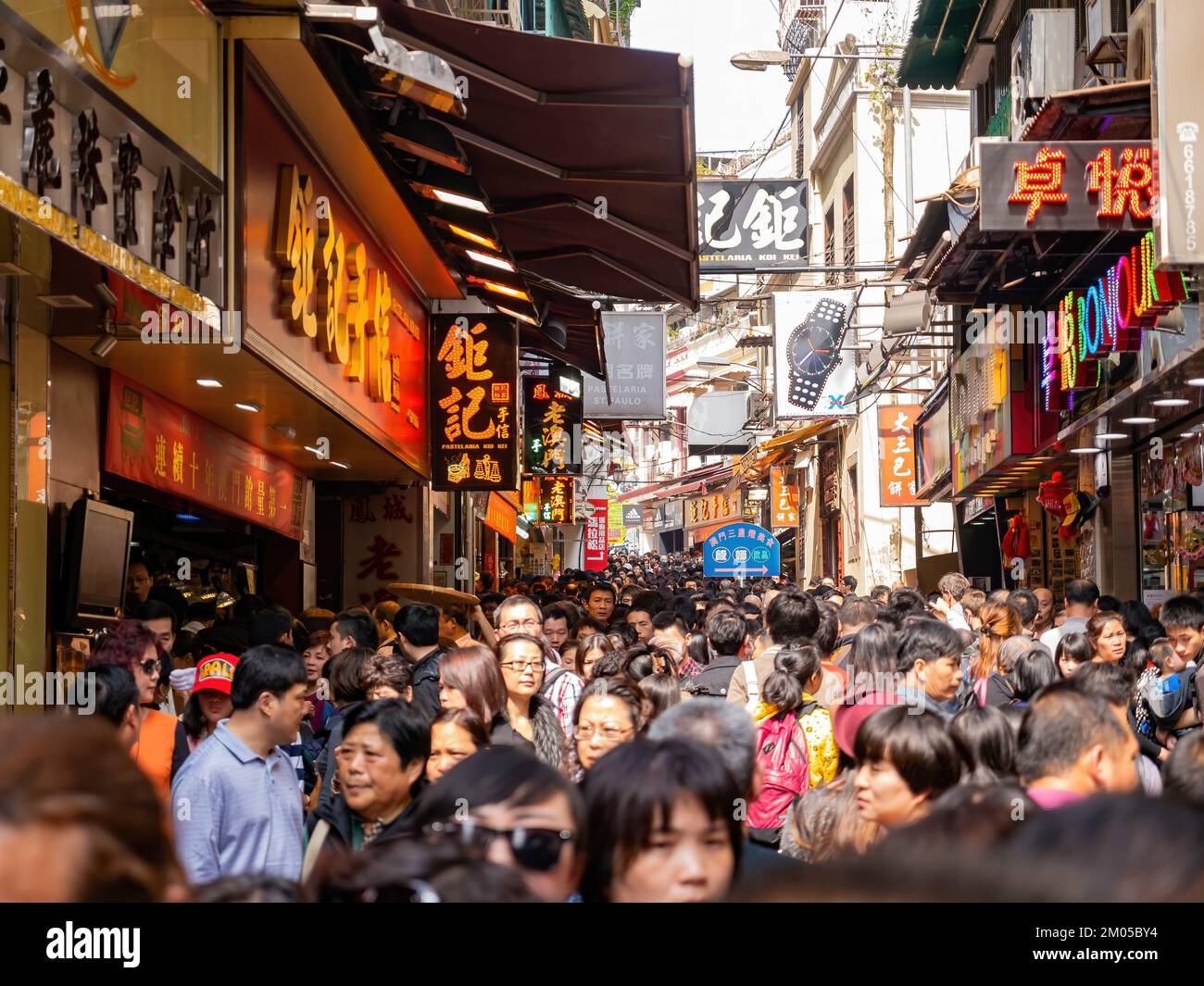 Macau, FEB 12 2013 - Many people walking near the Company Of Jesus ...