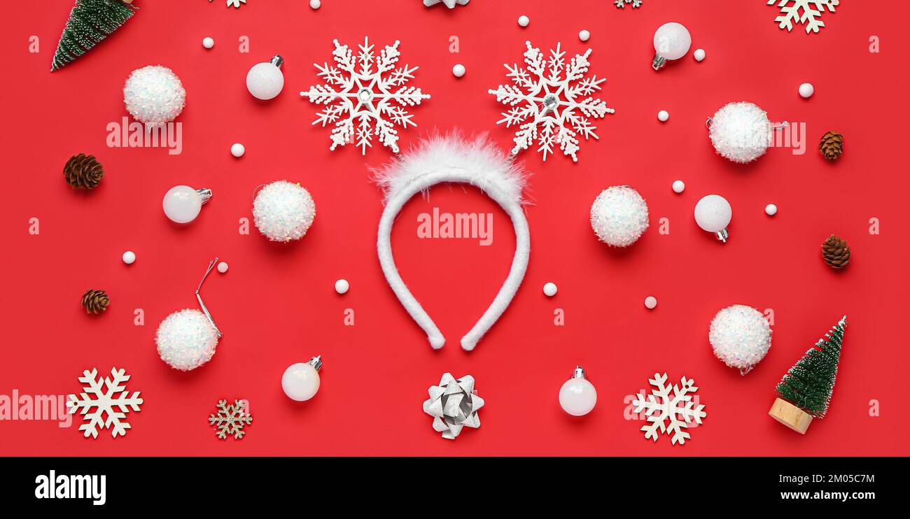 Composition with beautiful Christmas headband and decorations on red ...