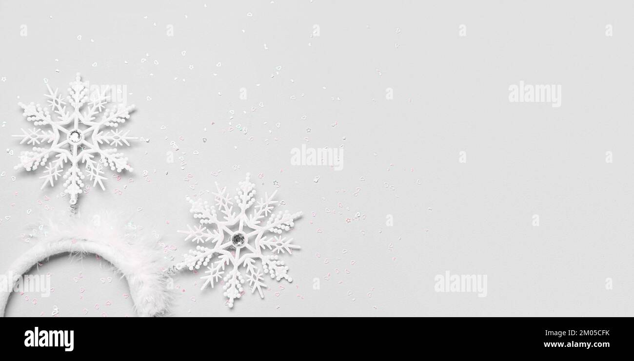 Beautiful Christmas headband and confetti on light background with ...