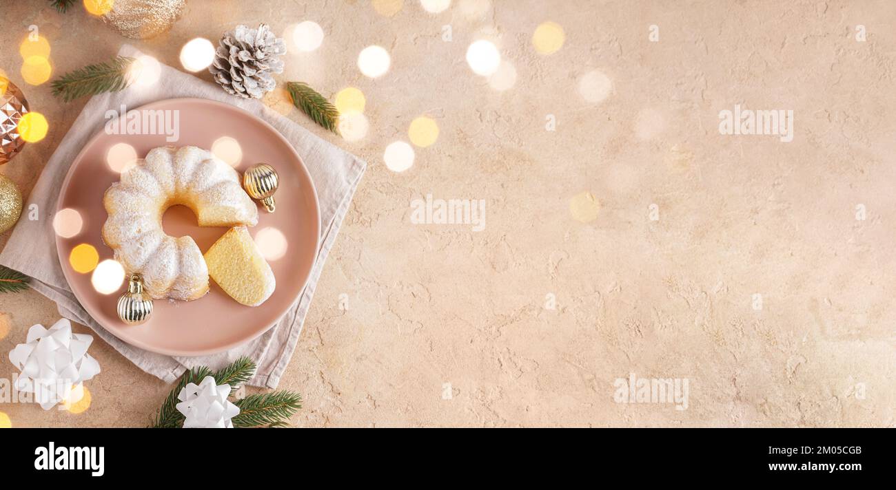 Tasty Christmas cake and decor on beige background with space for text ...