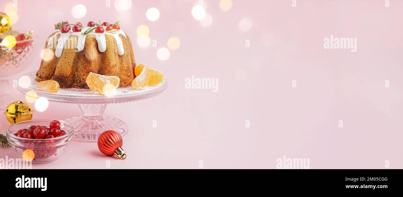 Tasty Christmas cake and decor on pink background with space for text ...