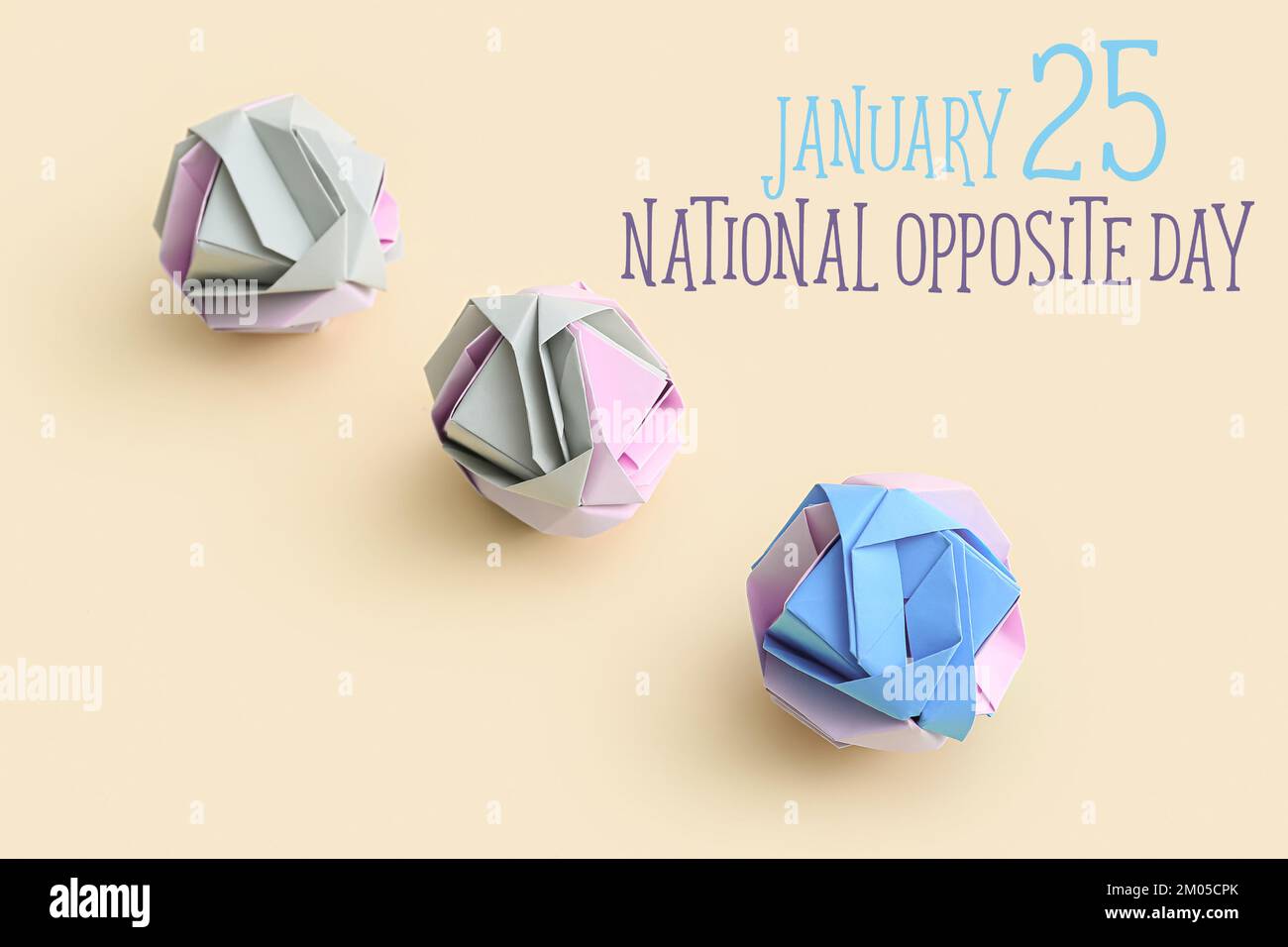 Origami on light background. National Opposite Day Stock Photo - Alamy