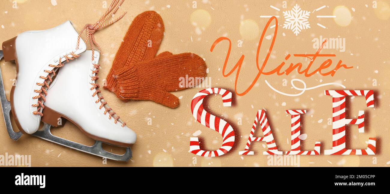 Banner for winter sale with ice skates and mittens on brown background ...