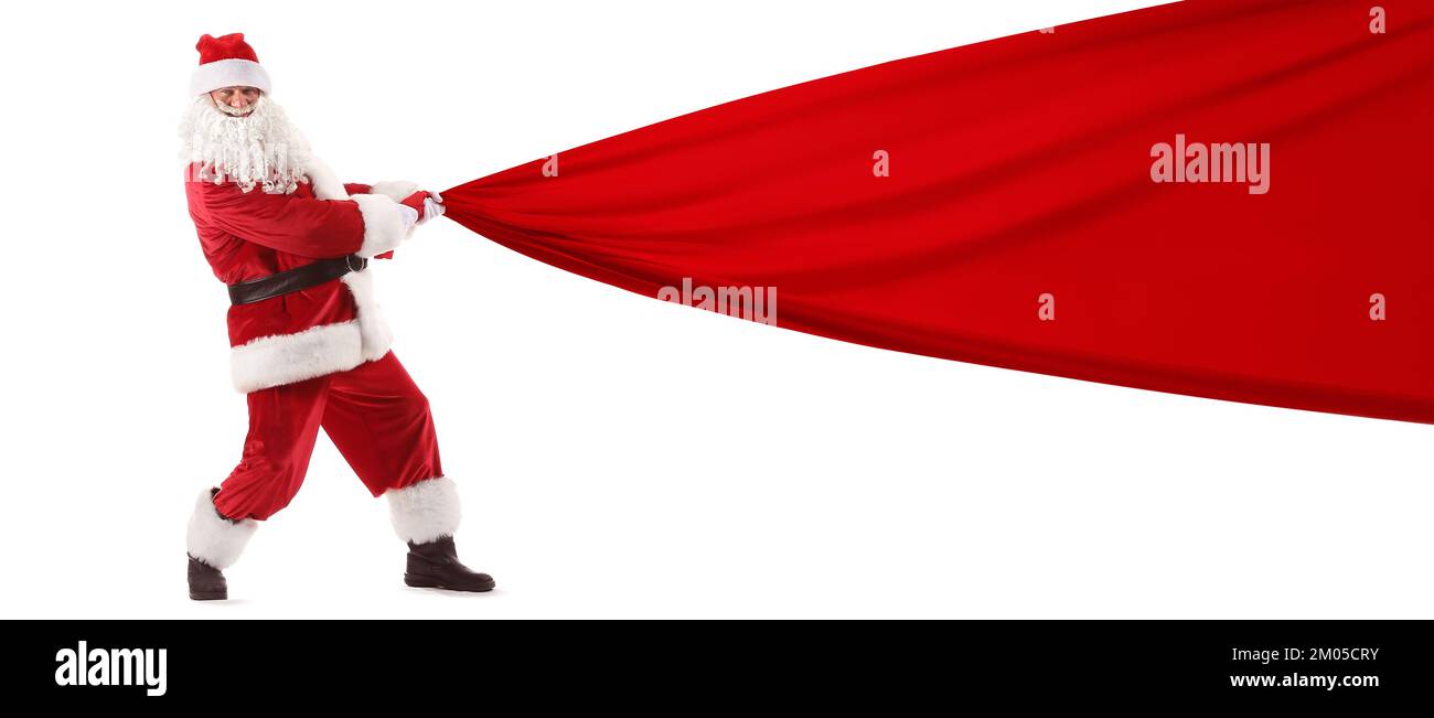 Santa Claus pulling big bag against white background Stock Photo - Alamy