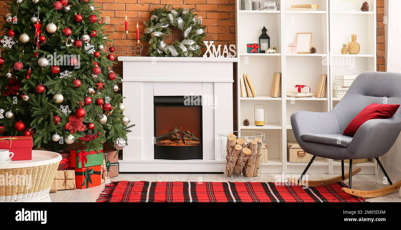 Interior of living room with fireplace and Christmas tree Stock Photo ...