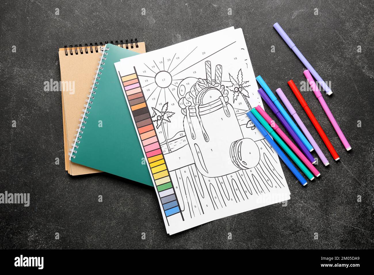 Coloring page, felt-tip pens and notebooks on dark background Stock ...